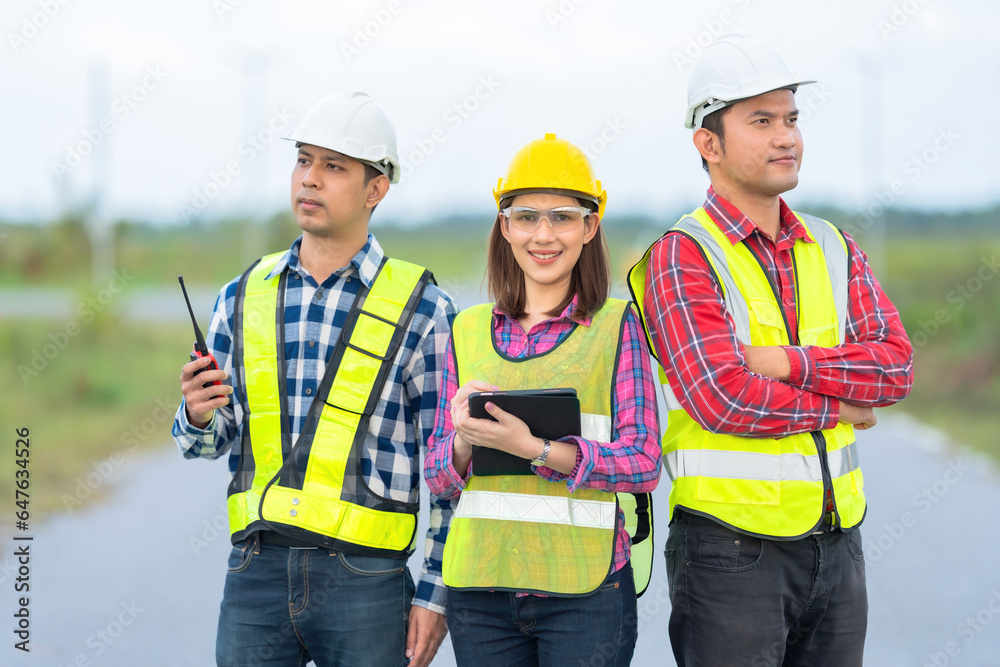 Half-body photograph of a team of 3 male and female engineers. Asian ...