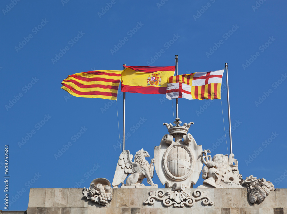 Flags flying above barcelona town hall (from left catalan spanish and ...