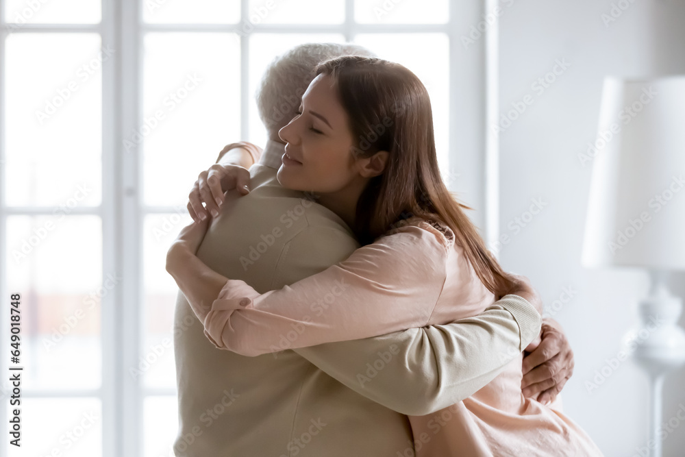 Stock-Foto Loving millennial adult girl child hug elderly 80s father ...