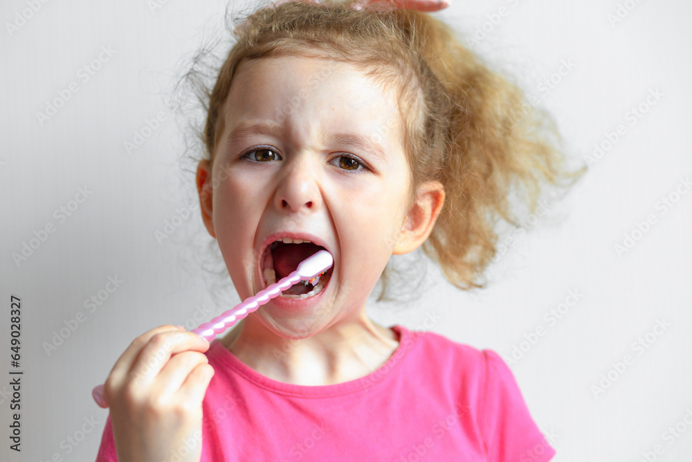 portrait cute little girl brushing, cleaning teeth with toothbrush and ...