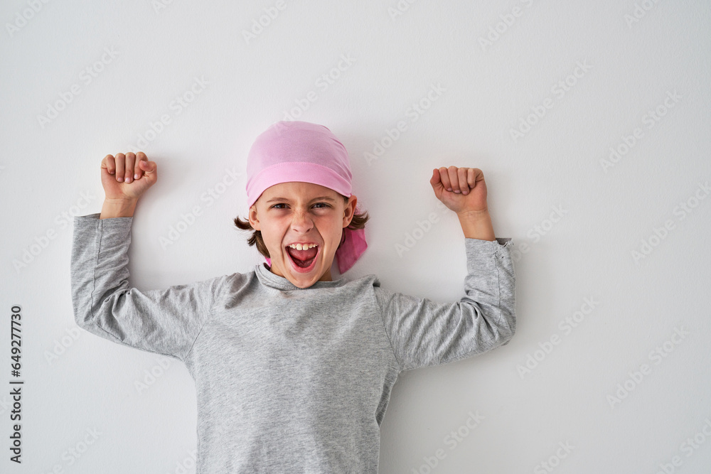 Excited kid screaming while celebrating victory over cancer Stock Photo ...