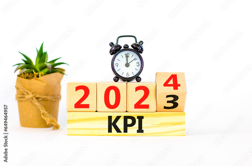KPI, key performance indicator symbol. Businessman turns wooden cubes ...