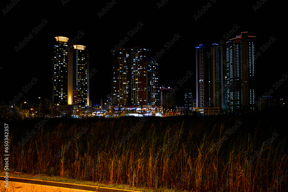 Incheon City Skyline at night in South Korea with tall clusters of ...
