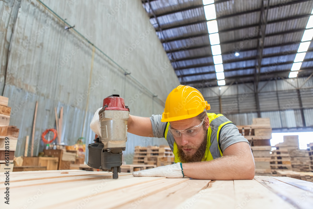Male engineer carpenter wearing safety uniform and yellow hard hat ...
