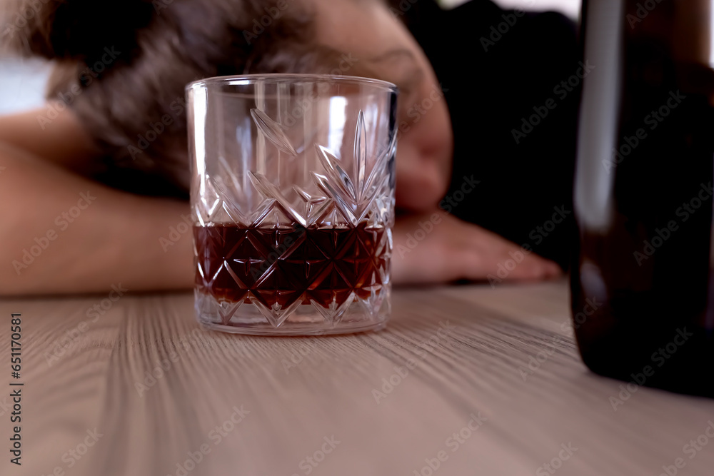 Drunk intoxicated woman sleeping near whiskey glass, female heavy ...