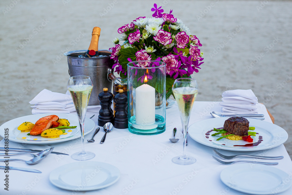 Beachside dinner table,Romantic sunset dinner on the beach. Table ...