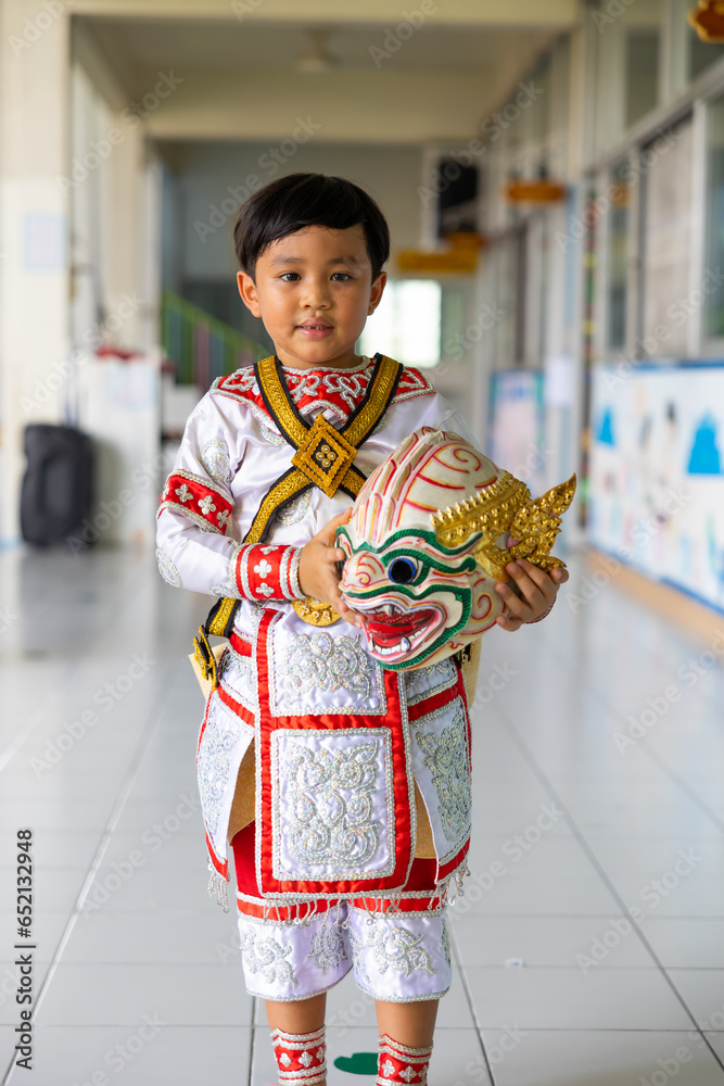 Happy and smile Asian boy wearing Hanuman Khon. Hanuman is Thailand ...