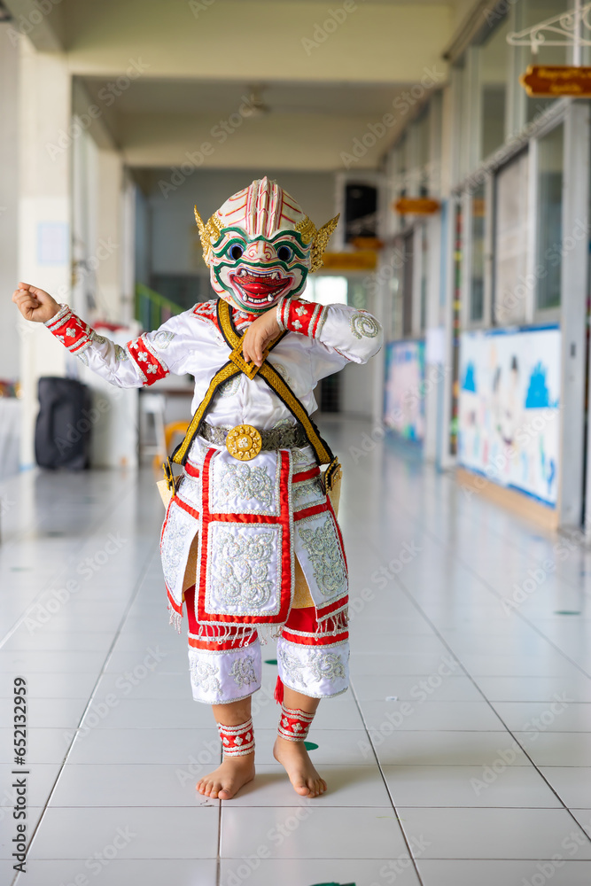Happy and smile Asian boy wearing Hanuman Khon. Hanuman is Thailand ...