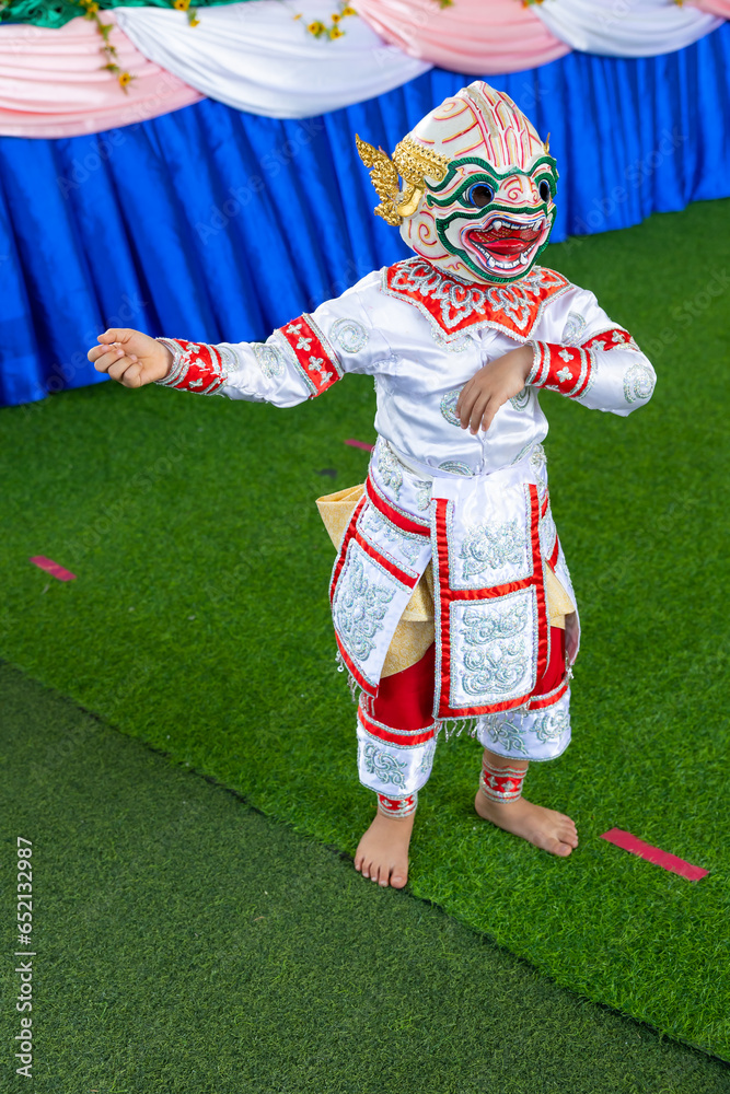 Happy and smile Asian boy wearing Hanuman Khon. Hanuman is Thailand ...