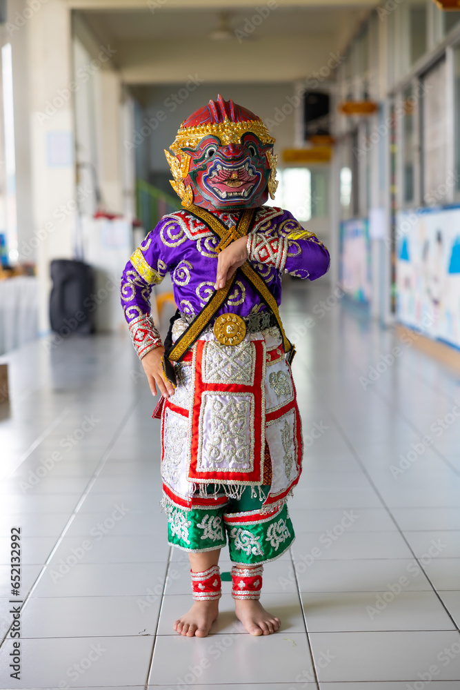 Happy and smile Asian boy wearing Hanuman Khon. Hanuman is Thailand ...