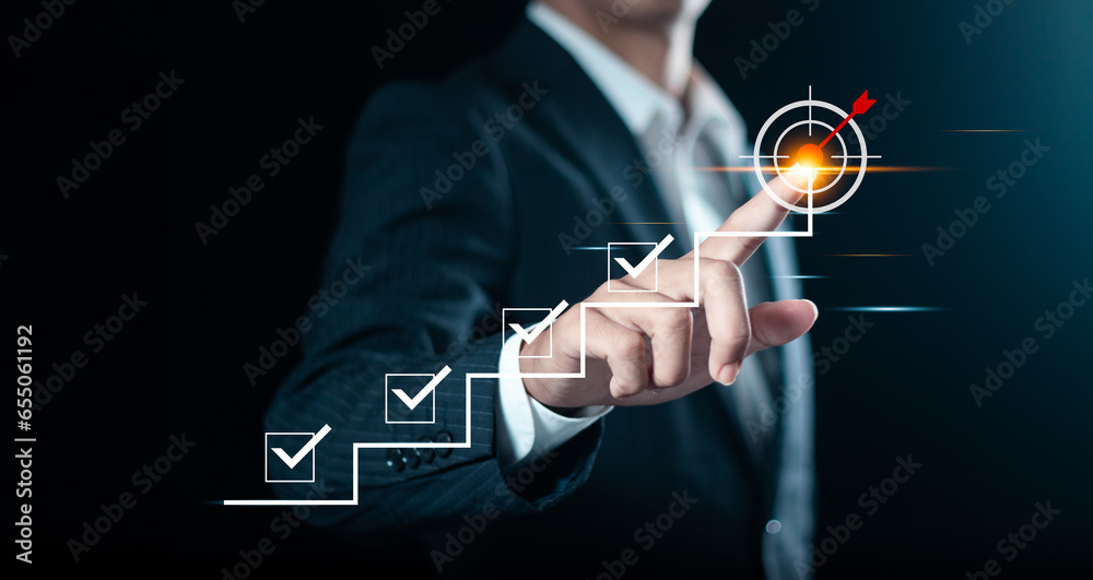 Steps and actions towards aiming business goals. Businessman touching ...
