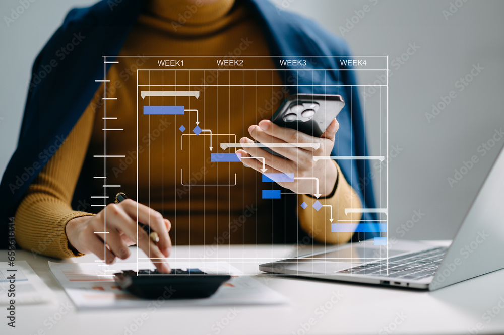 Project manager working and update tasks with milestones progress ...