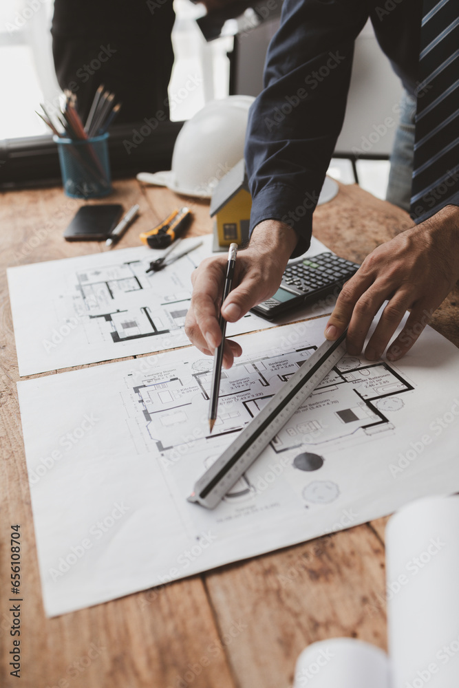 Architects design house plans for clients, drawing plans according to ...