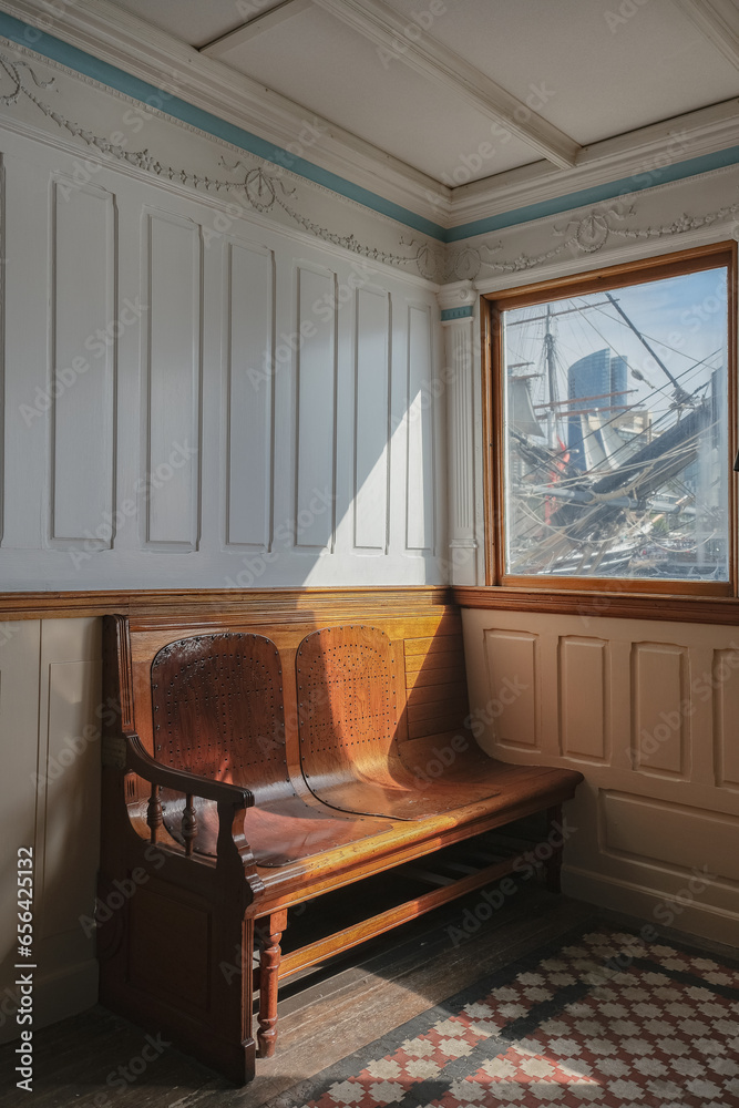Classic historic interiors of old ferry boat ship liner with wooden paneling, brass glass ...
