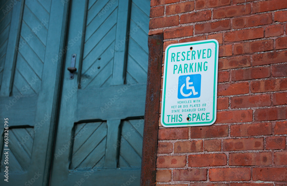 handicap wheelchair-accessible sign against a blurred background ...