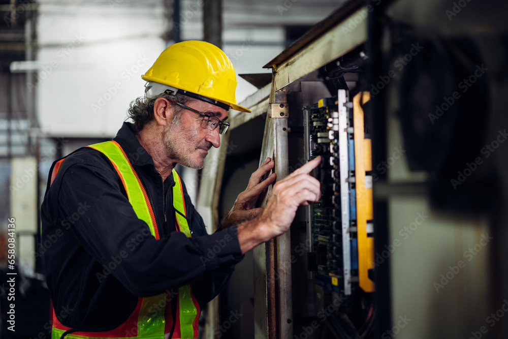 Mechanical Engineering Team Operating Machinery in a Manufacturing ...