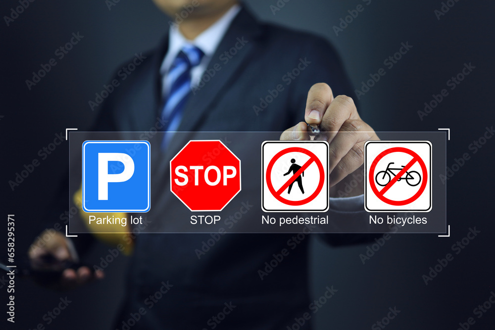 Safety staff or engineer pointing on city traffic sign to warning ...