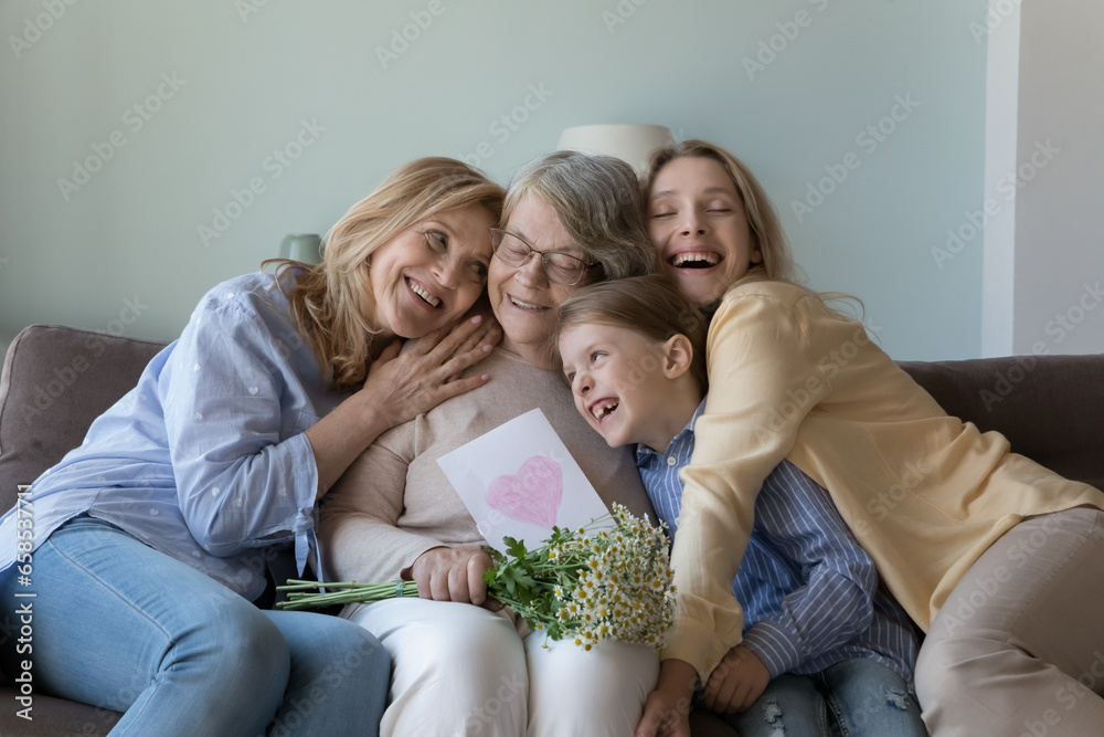 Cheerful girls and women congratulating eldest great grandma on ...