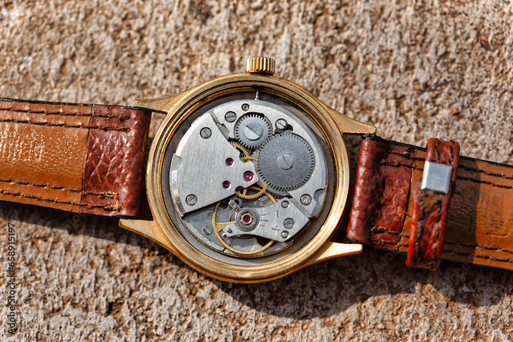 vintage wristwatch with the case opened revealing the mechanical ...