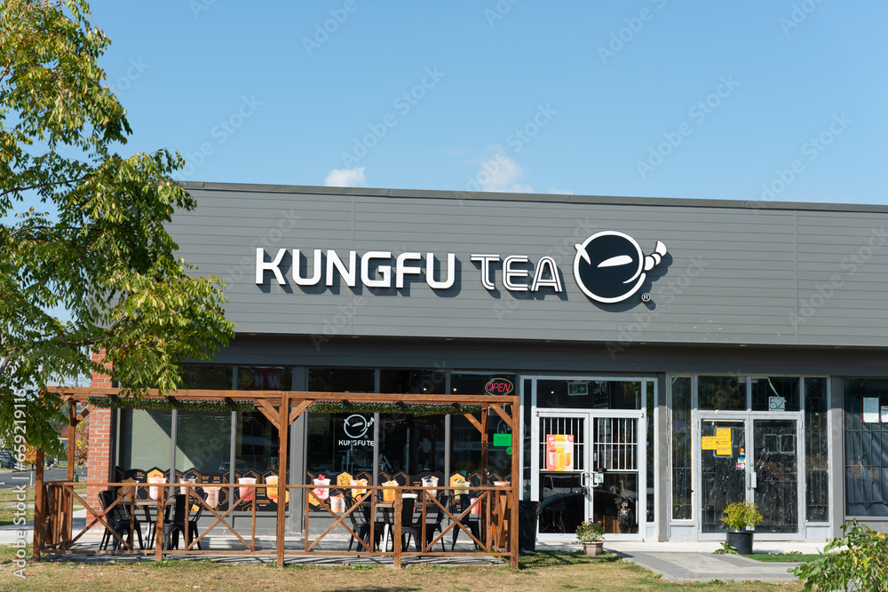 exterior building entrance facade and sign of Kungfu Tea located on ...