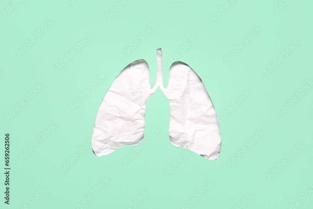 Cut out paper lungs on turquoise background. Lung cancer concept Stock ...