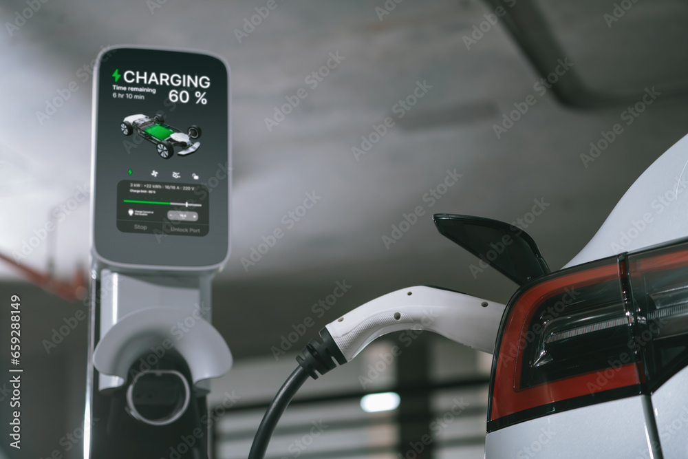 EV electric car recharge at shopping center parking lot charging in ...