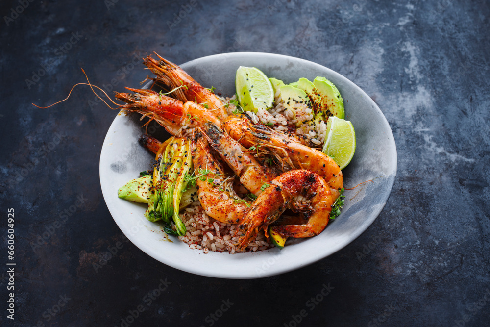Traditional Thai fried king prawns with Asian vegetable, avocado slices ...