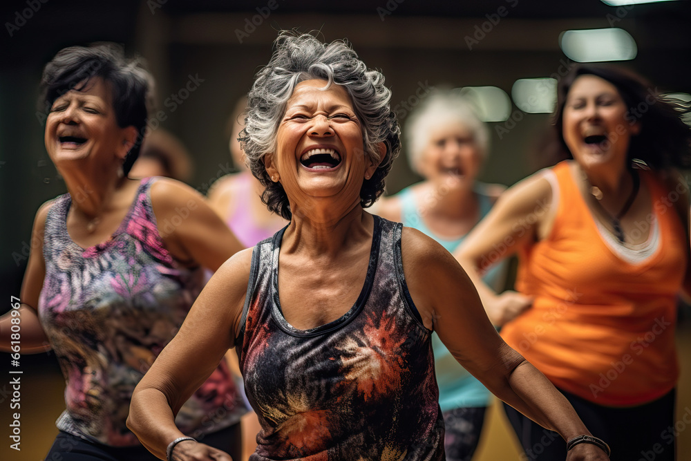 Foto de Stock Image of a group of women over 50 years old doing a Zumba ...