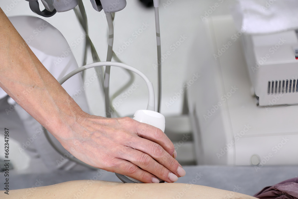 Foto de Stock Ultrasonic examination of internal organs. A man on an ...
