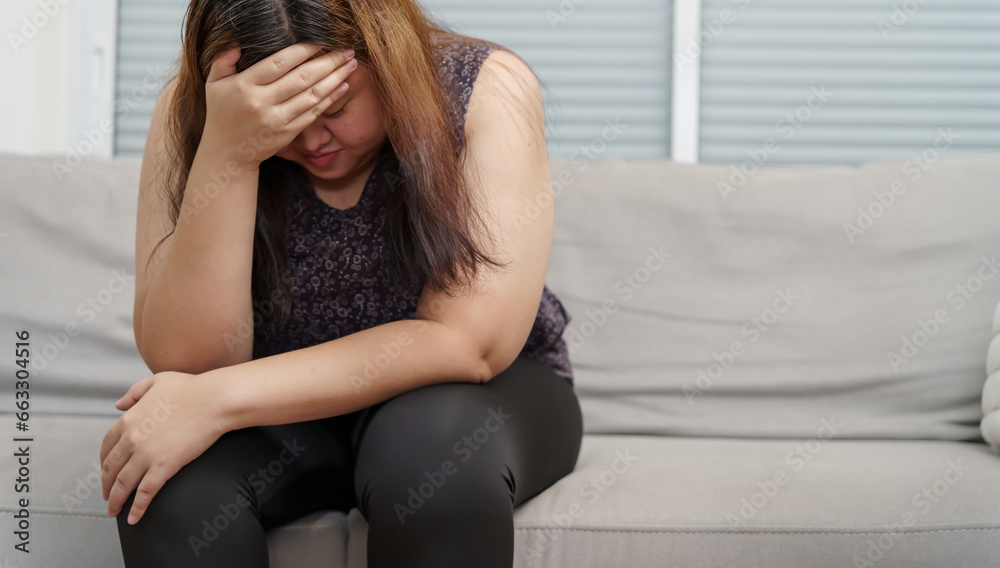 Sad Overweight plus size woman thinking about problems on sofa upset ...