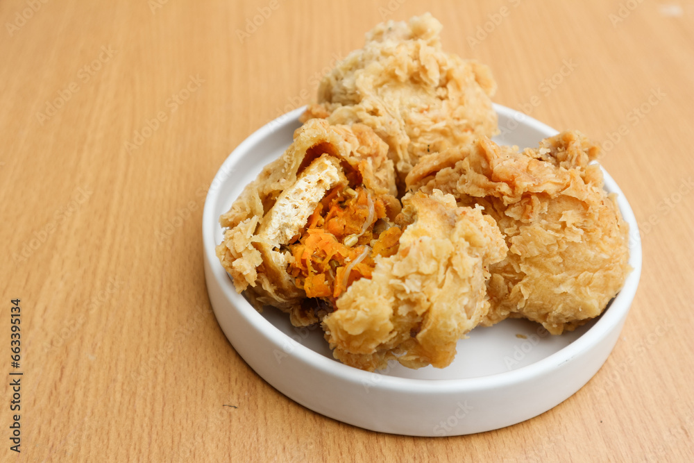 Fried tofu with spicy chiken filling. Often referred to as Tahu Mercon ...