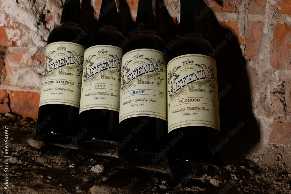 Bottles of spanish sherry Leyenda on brick wall background. Ukraine ...