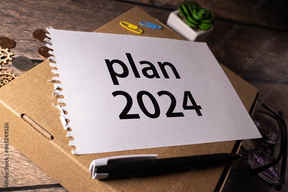 Paper plate, marker, diagram, chart and office tools. Text PLAN 2024 ...