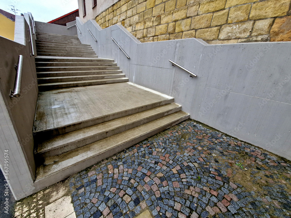 a staircase with concrete sides at a public building. the safe ...
