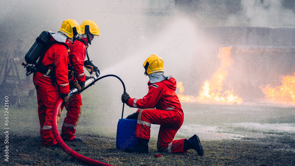 Fearless Firefighters Battling Blaze with Water and Extinguishers ...