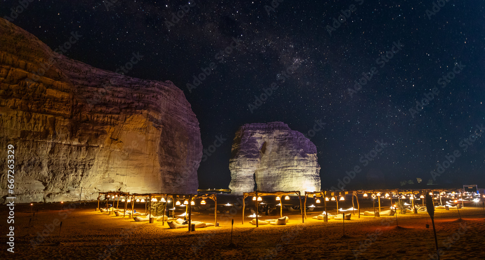 Illuminated outdoor lounge in front of elephant rock erosion monolith ...