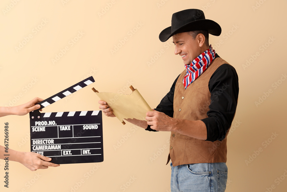 Mature actor dressed as cowboy holding treasure map and hands with ...