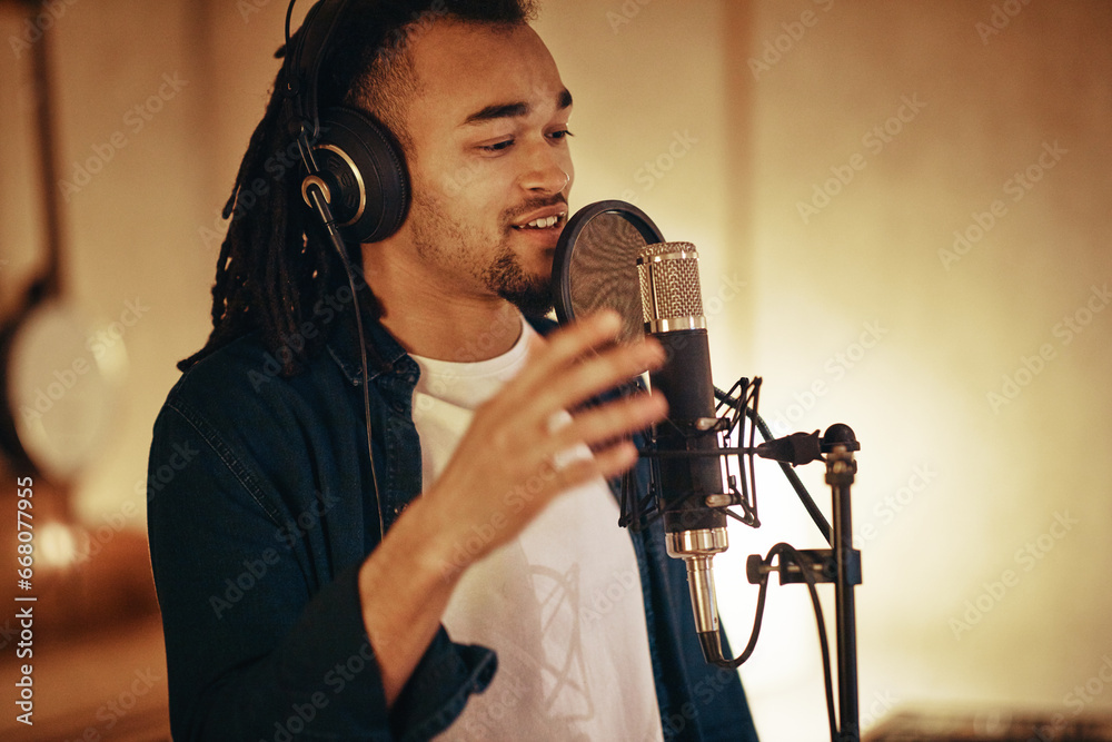 Young singer laying down tracks in a recording studio Stock Photo ...
