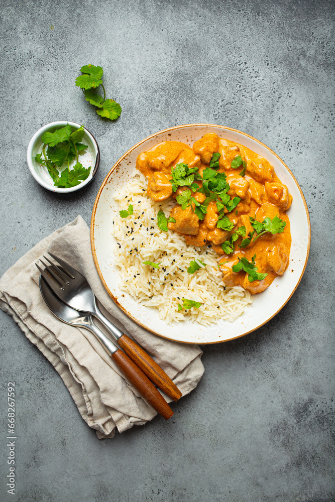 Traditional Indian dish chicken curry with basmati rice and fresh ...