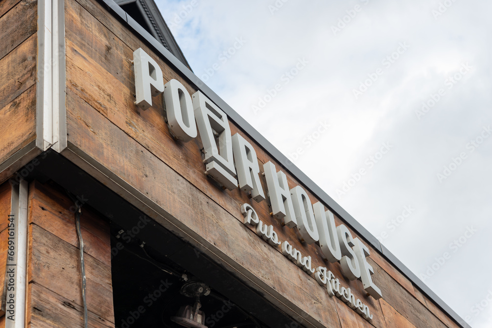 exterior building sign of Pour House Pub and Kitchen, a pub, located at ...