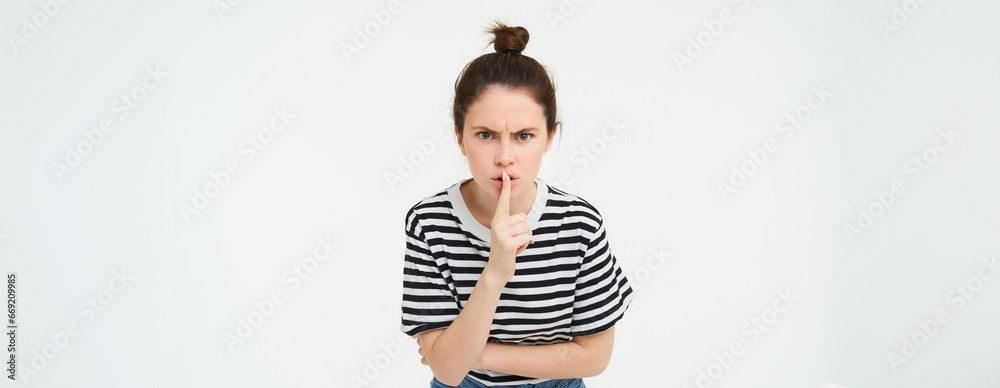 Image of angry woman shushing, makes hush gesture, press finger to lips ...