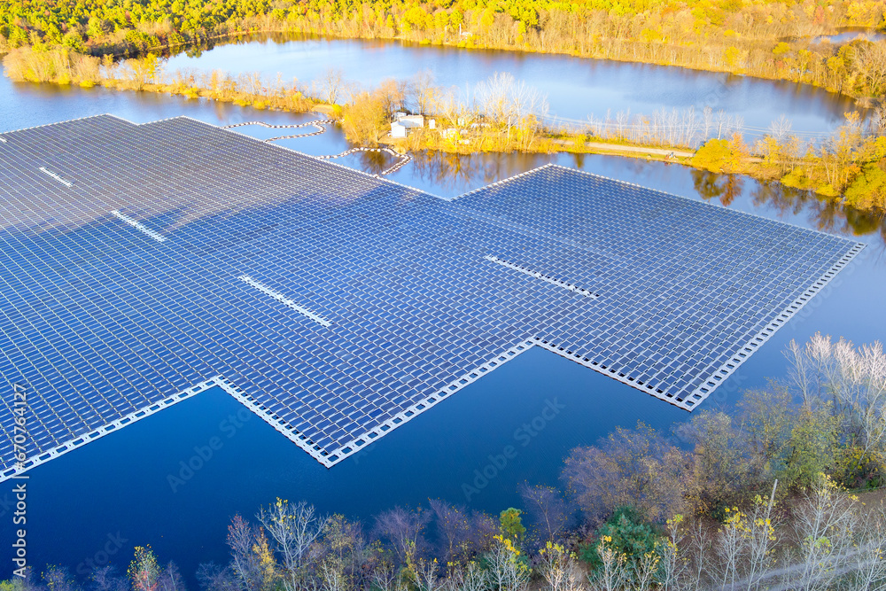 Pond with floating solar panels that generate electricity from sun by ...