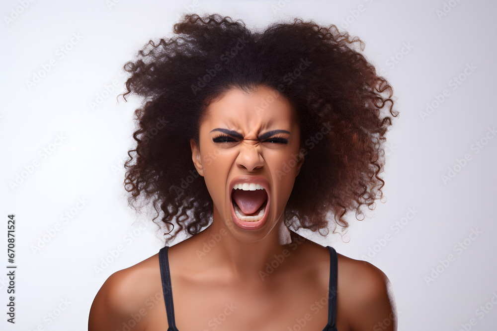 Angry young adult African American woman yelling, head and shoulders ...