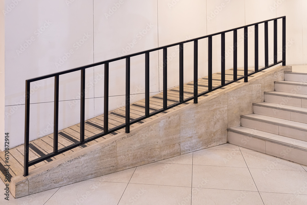 ramp for the wheelchair and stairs for normal people adjoining. Walking ...