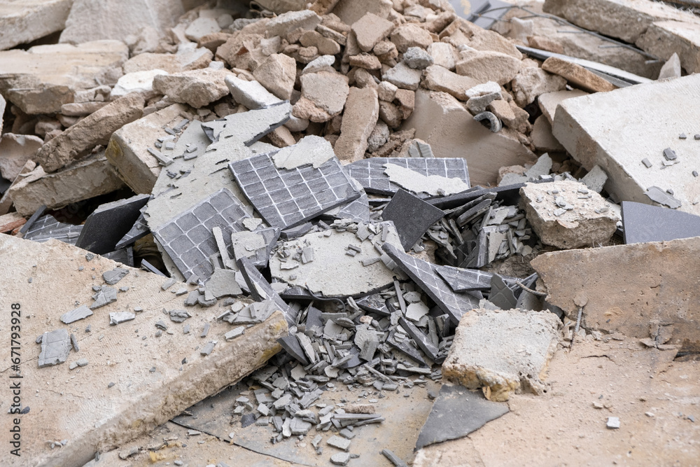 Shattered, broken wall bricks, construction waste after building ...