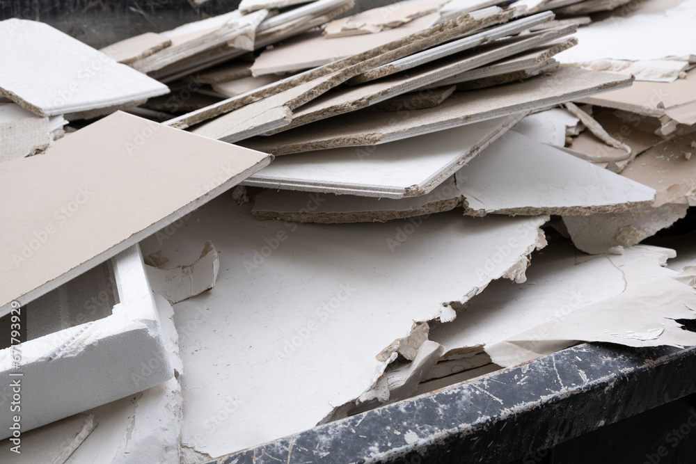 A huge overloaded dumpster waste container, overflowing with ...