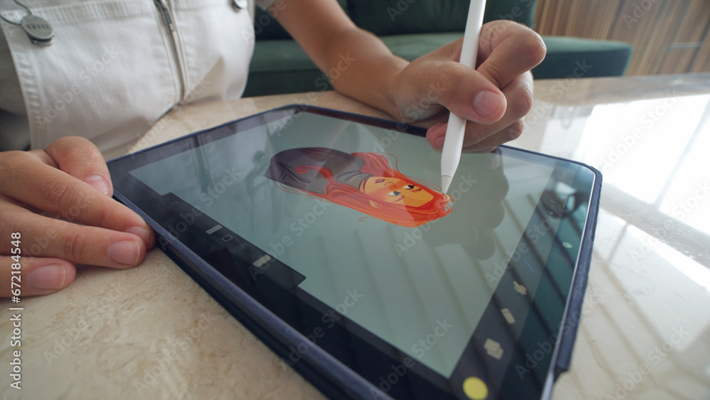 Digital artist draw pc tablet close up. Designer paint red head girl ...