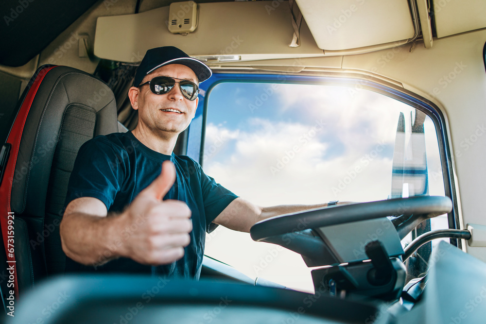 Foto de Stock Handsome experienced male truck driver with a hat sitting ...