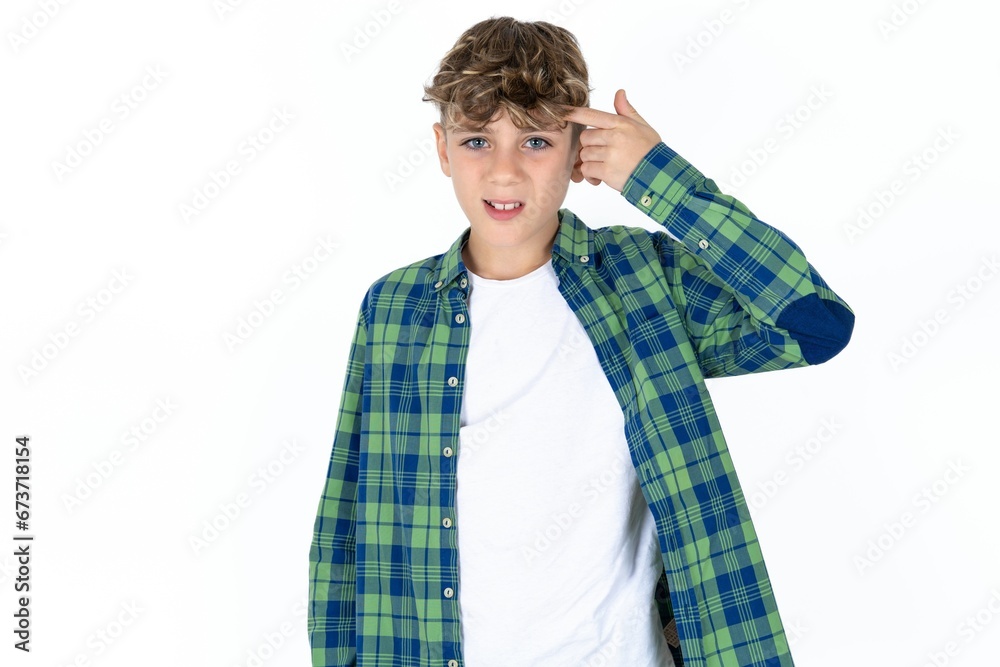 Caucasian teen boy pointing unhappy at pimple on forehead, blackhead ...