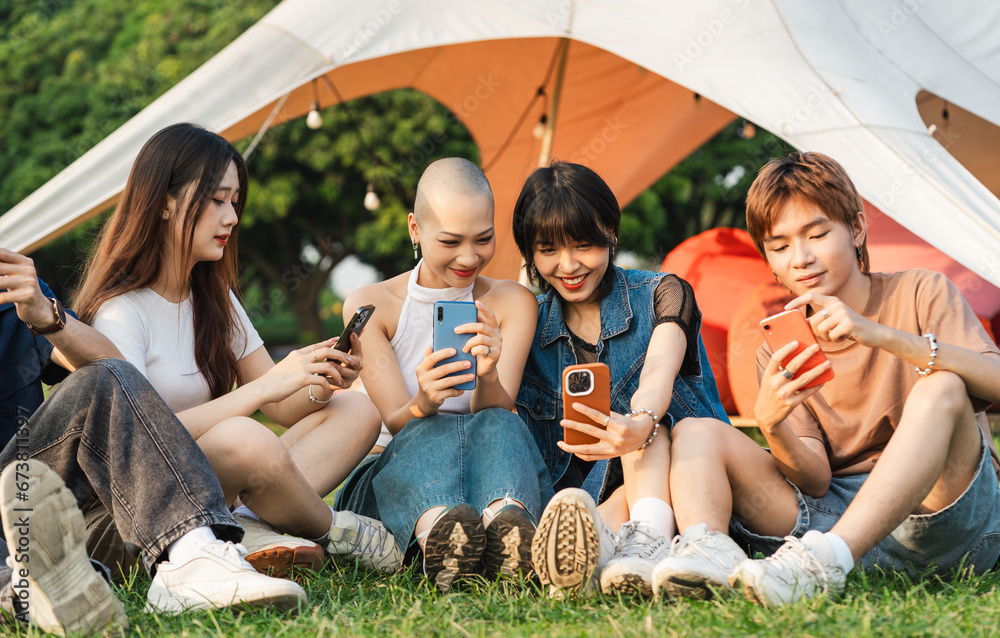 Image of a group of young Asian people laughing together and using ...